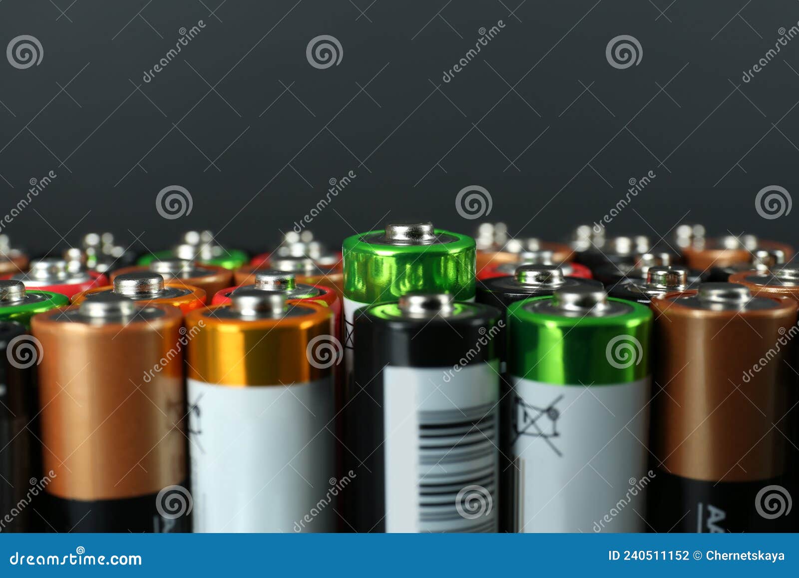 Many AA Batteries on Grey Background, Closeup. Space for Text Stock ...