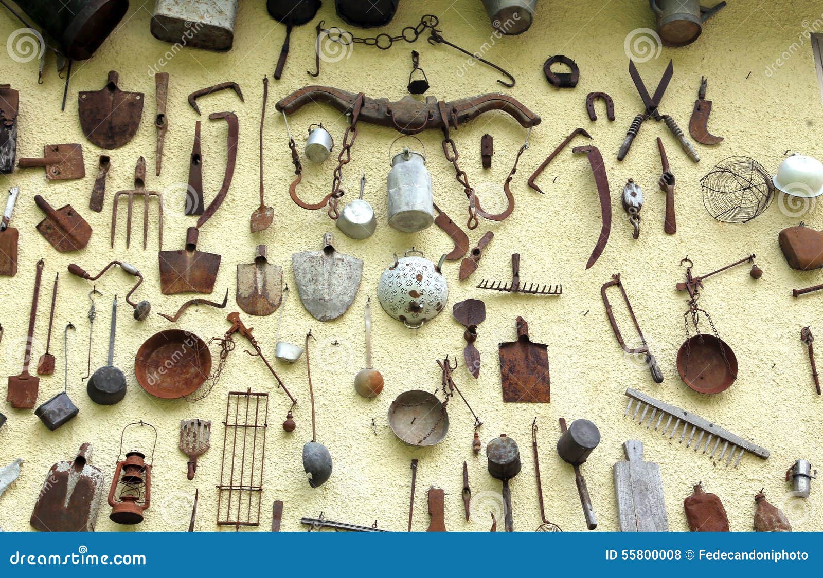 Many Ancient Farming Tools Hanging on the Wall Stock Photo - Image of ...