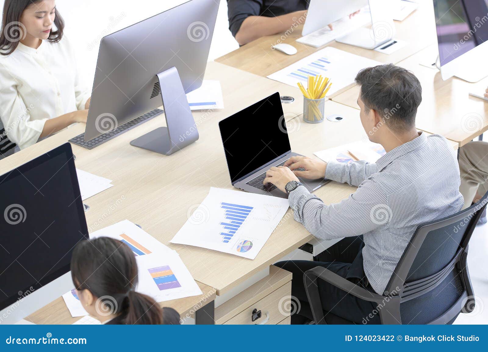 Many Asian Employees are Intent on Working with Modern Computers Stock ...