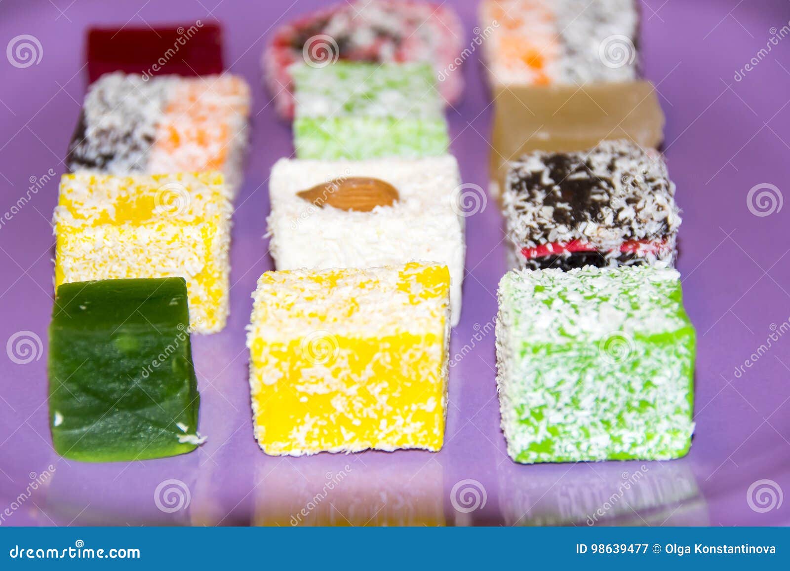 Many Assorted Multicolored Turkish Delight on Purple Background Stock ...
