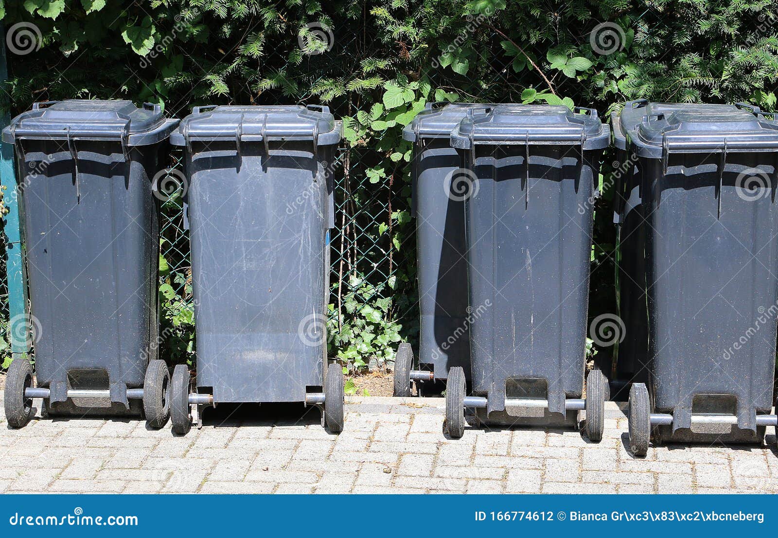 Many Black Garbage Cans are Standing in a Row Stock Photo - Image of ...