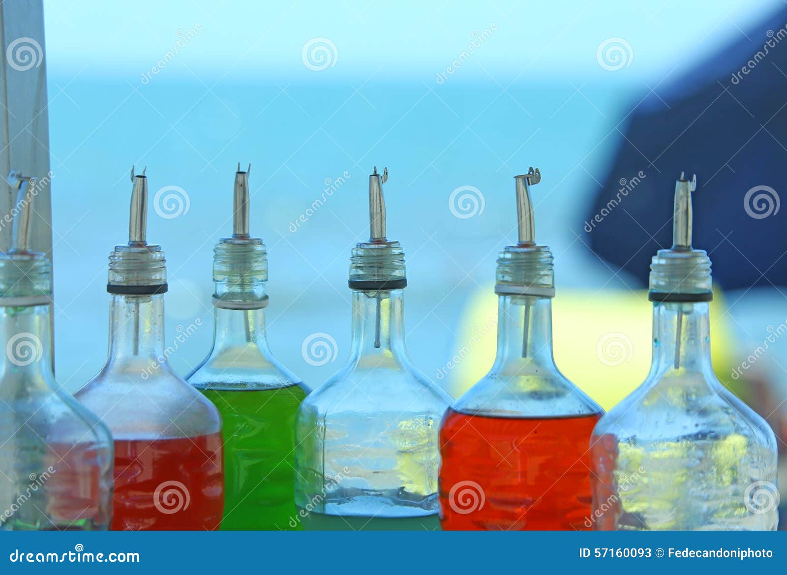 Many Bottles of Colored Syrup for Preparing Ice Creams on the Be Stock ...