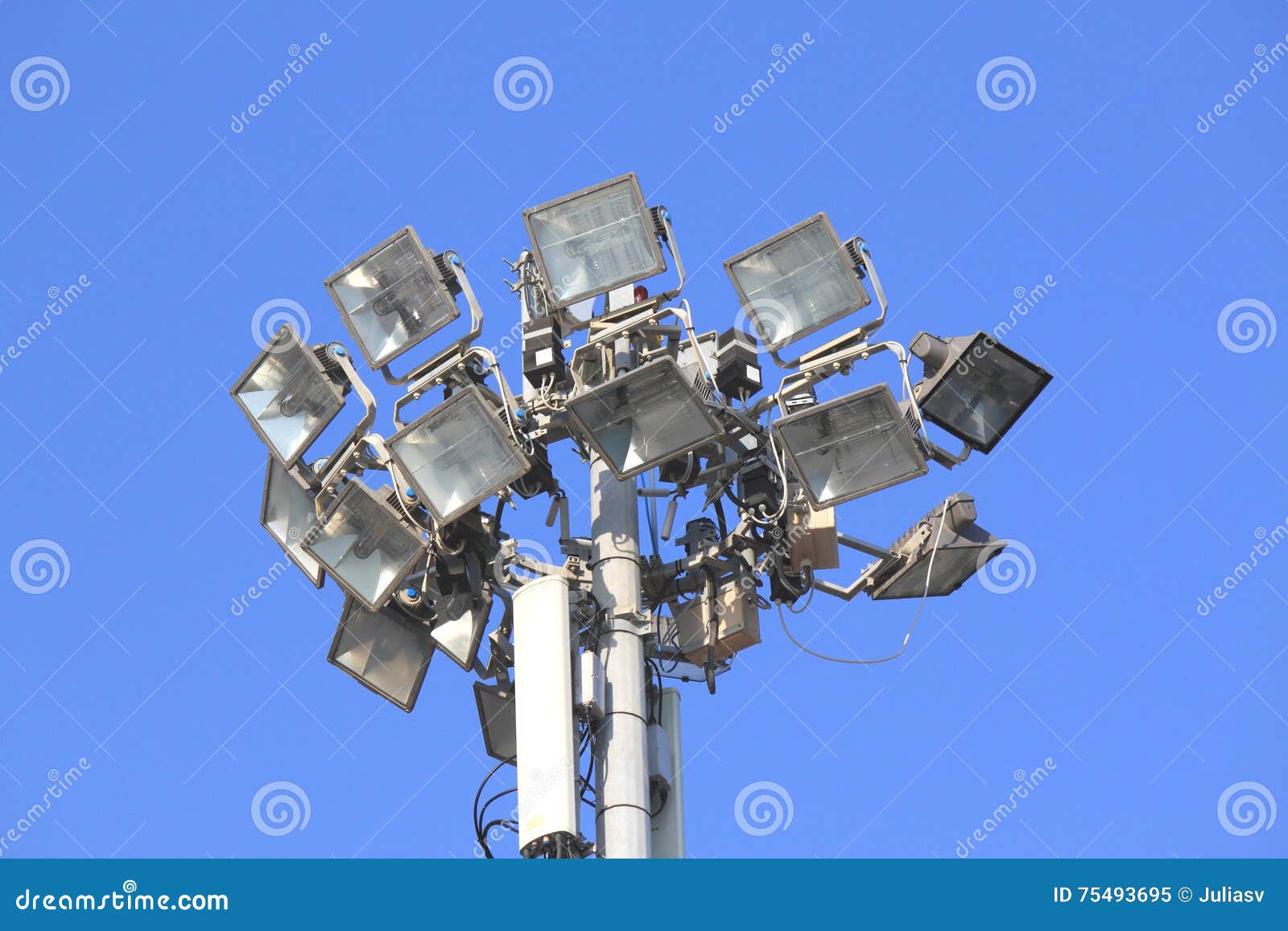 Many Bright Spotlights on a Pole Against the Blue Sky Stock Image ...
