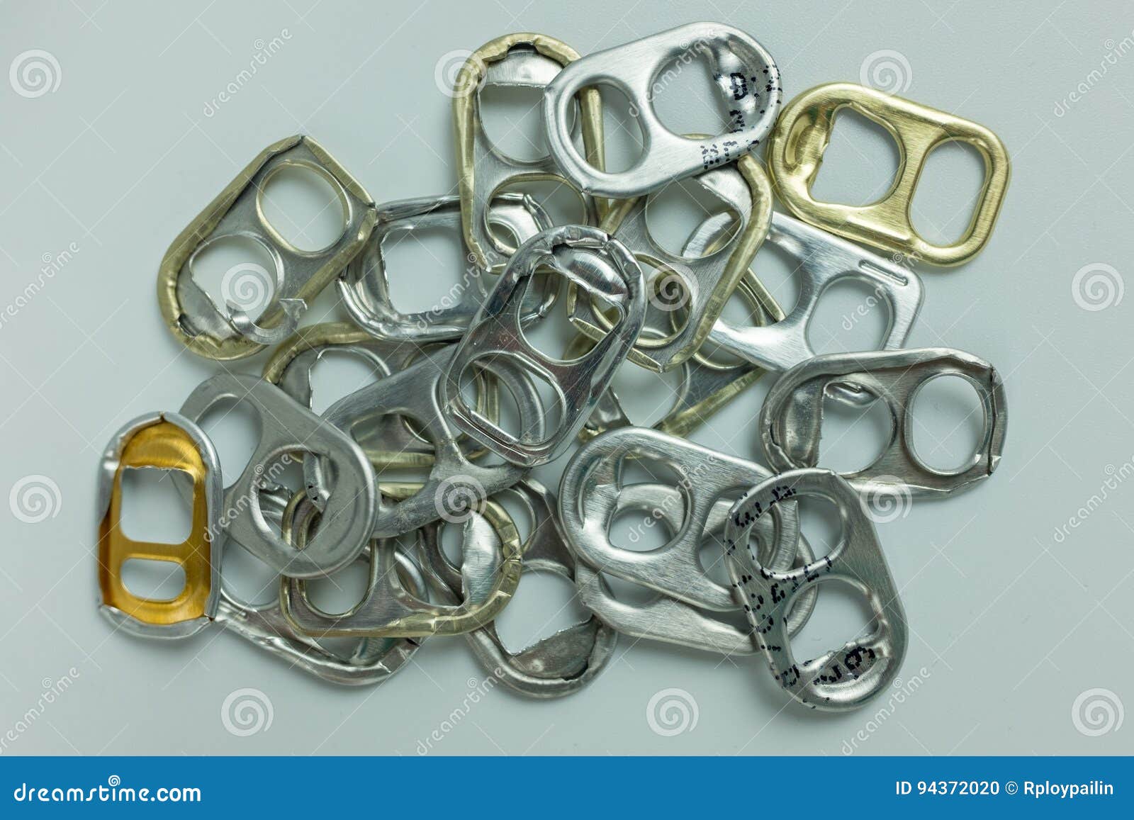 Many Bronze and Gold Pull Can Rings on White Background Stock Photo ...