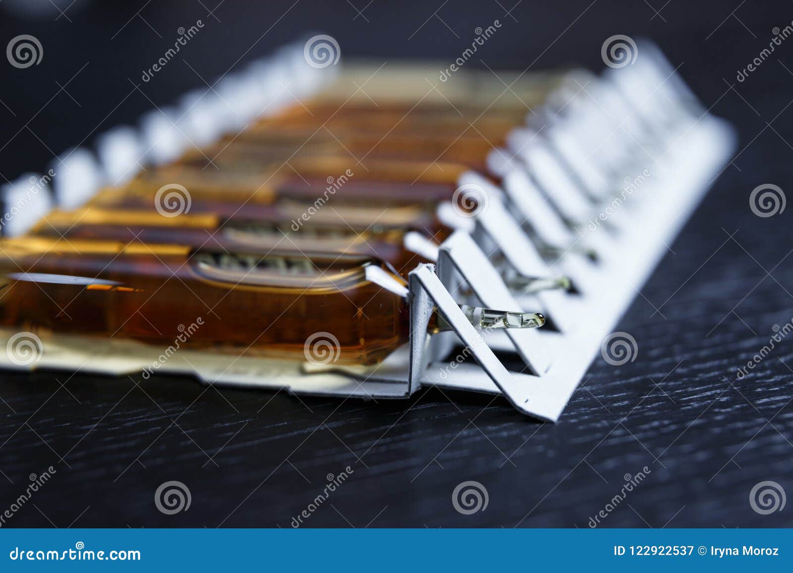 Many Brown Ampoules Set in Pharmaceutical Packaging White Container ...