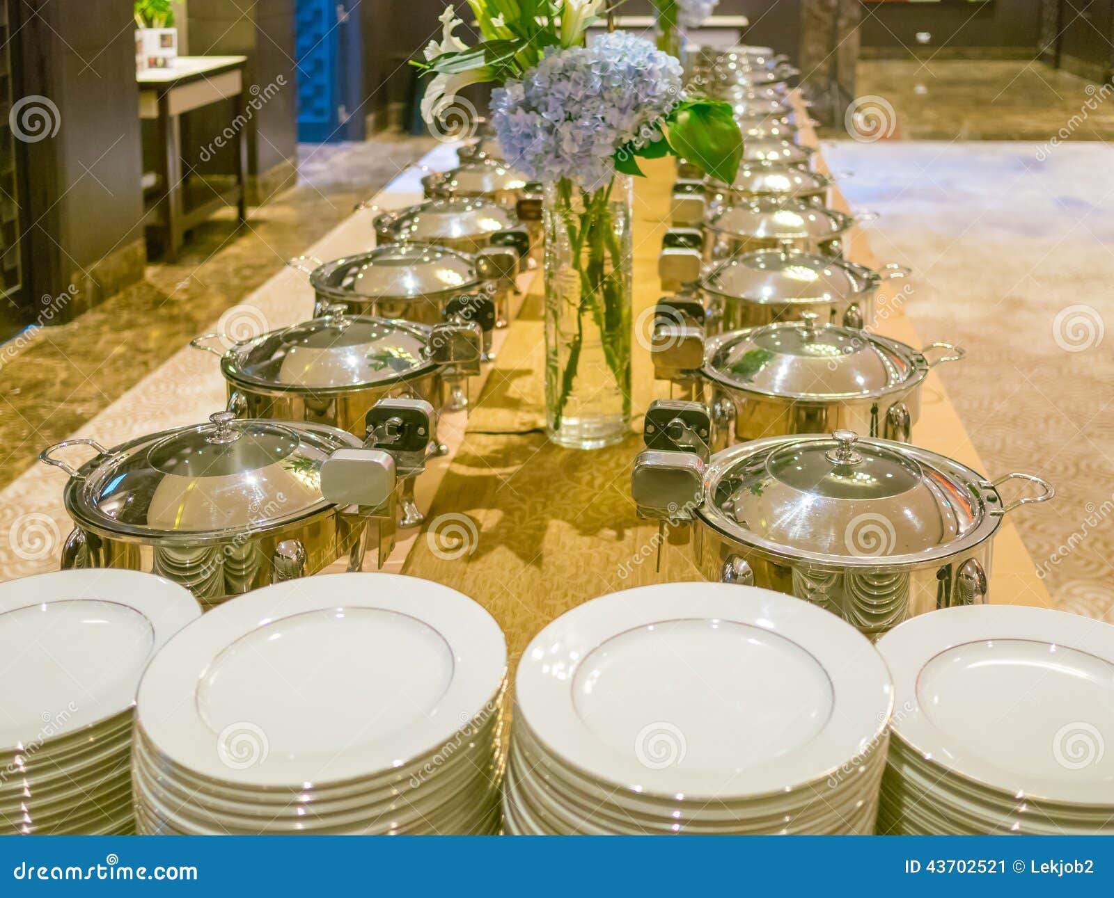 Many Buffet Heated Trays Ready For Service On The Blue Table. Buffet ...