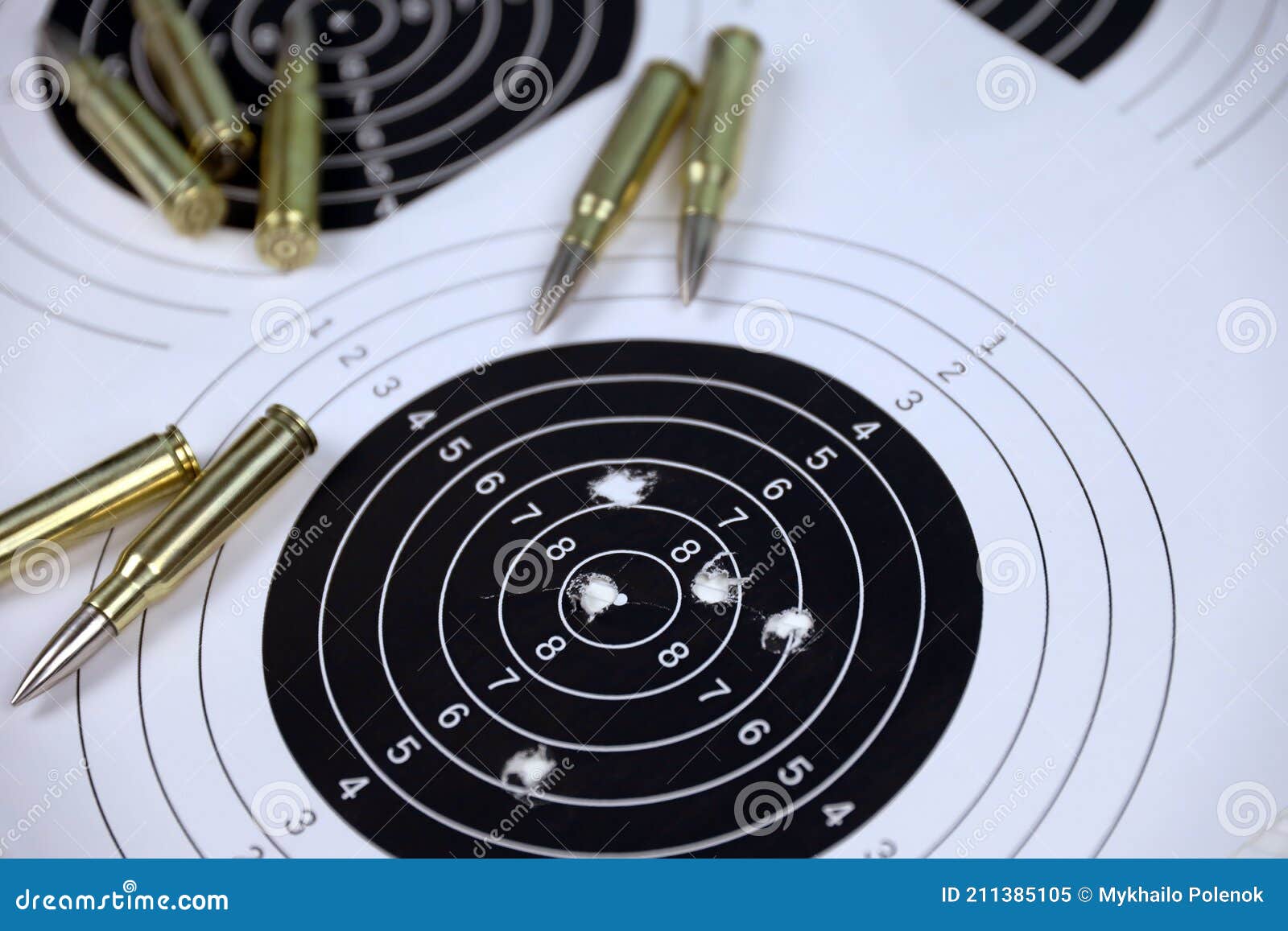 Many Bullets on Shooting Targets on White Table in Shooting Range ...