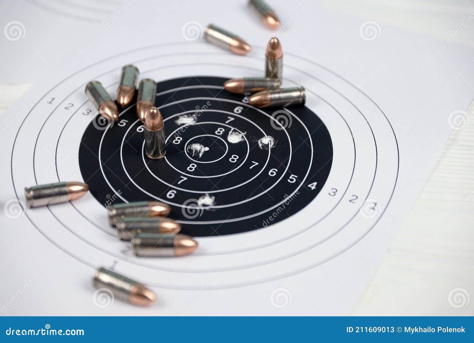 Many Bullets on Shooting Targets on White Table in Shooting Range ...