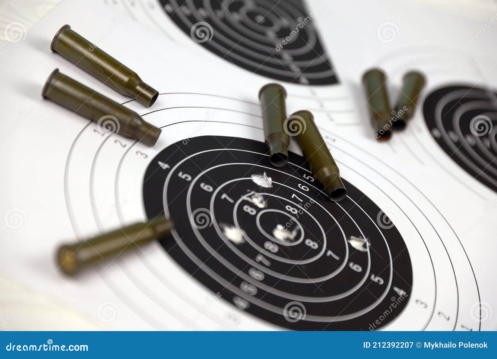 Gun And Many Bullets Shooting Targets On White Table In Shooting Range ...