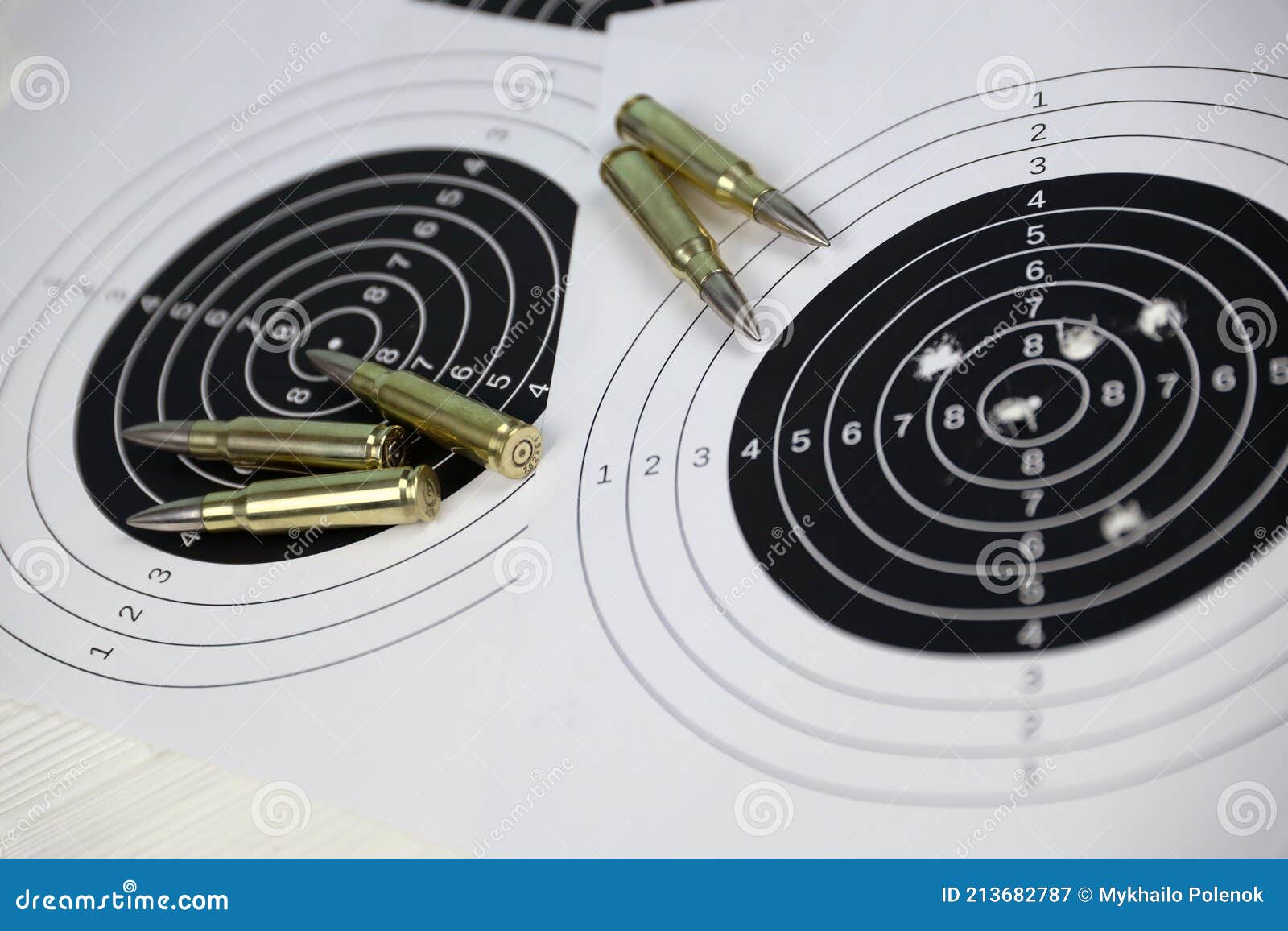 Many Bullets on Shooting Targets on White Table in Shooting Range ...