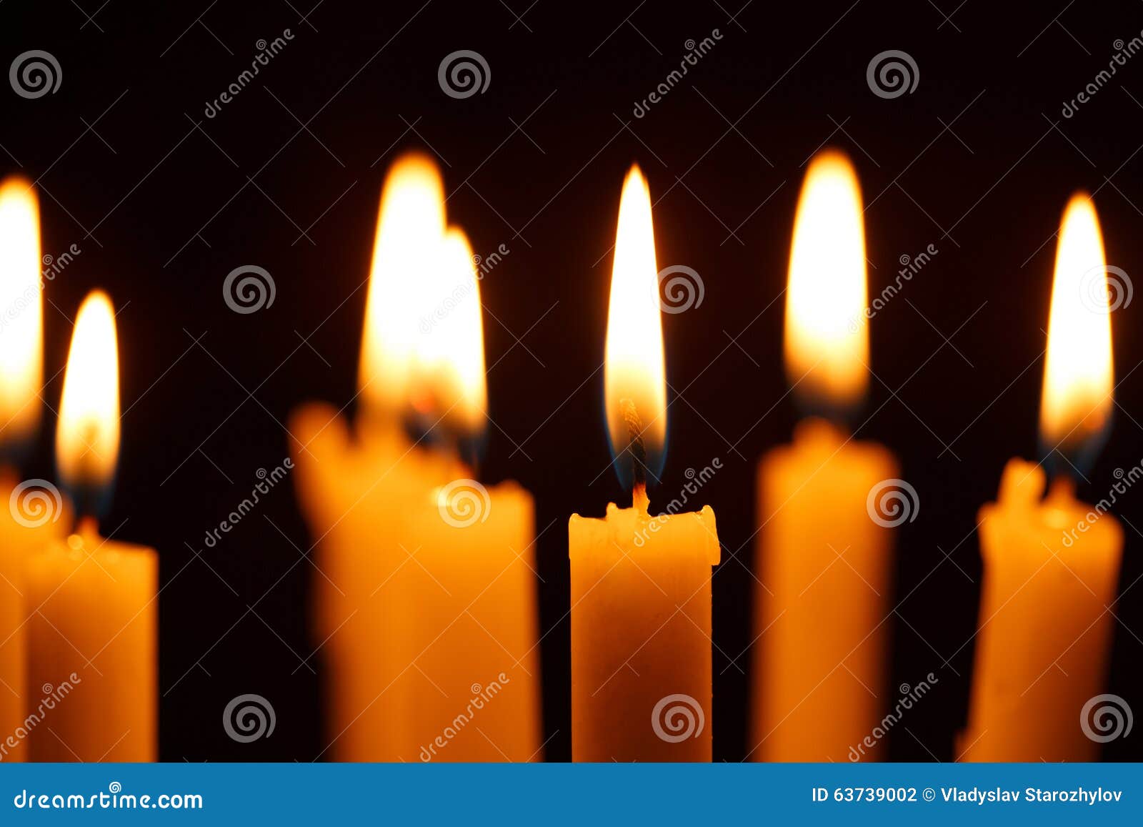 Many Burning Candles on Black Stock Photo - Image of fire, glowing ...