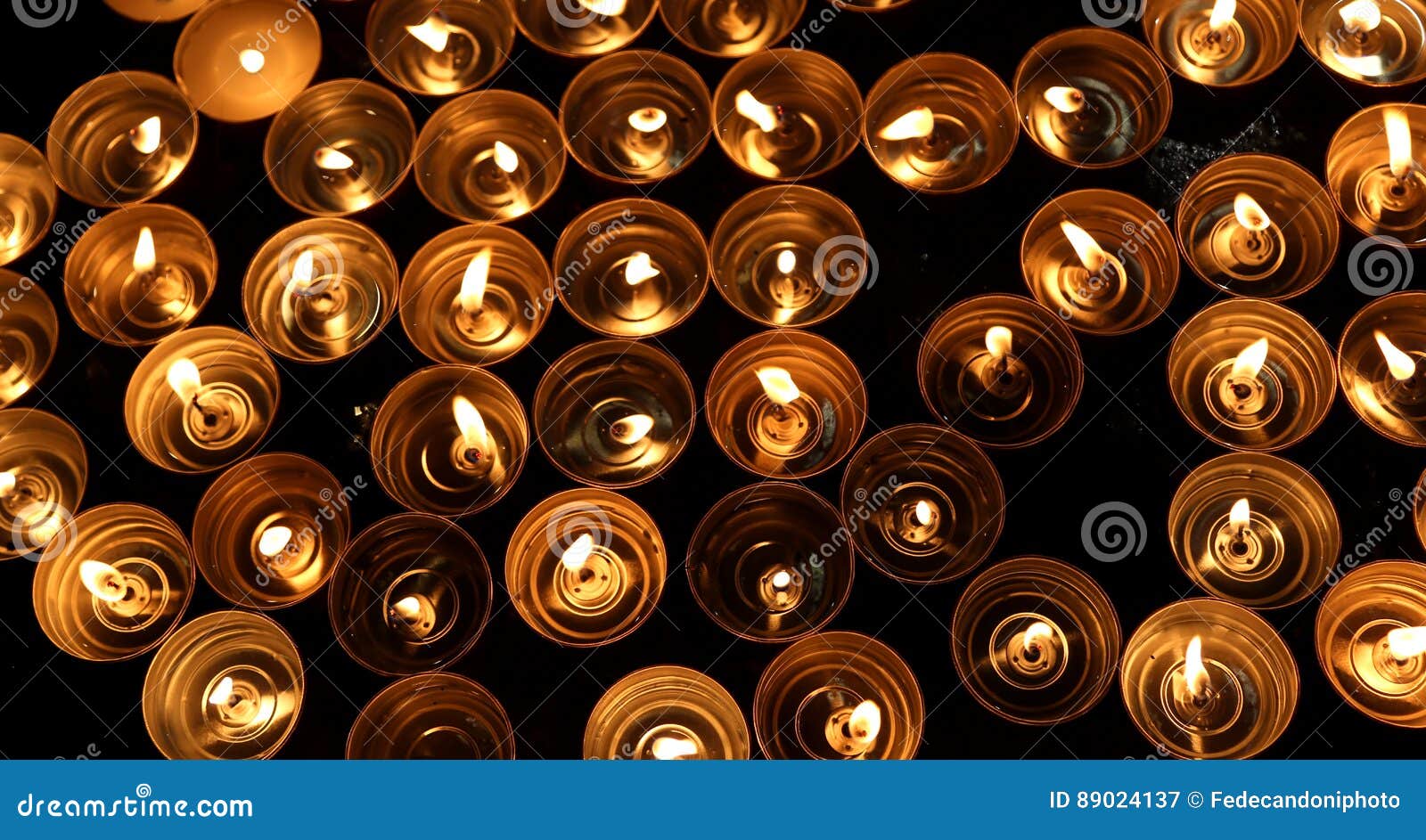 Many Candles Lit with the Warm Flame during the Religious Ceremo Stock ...