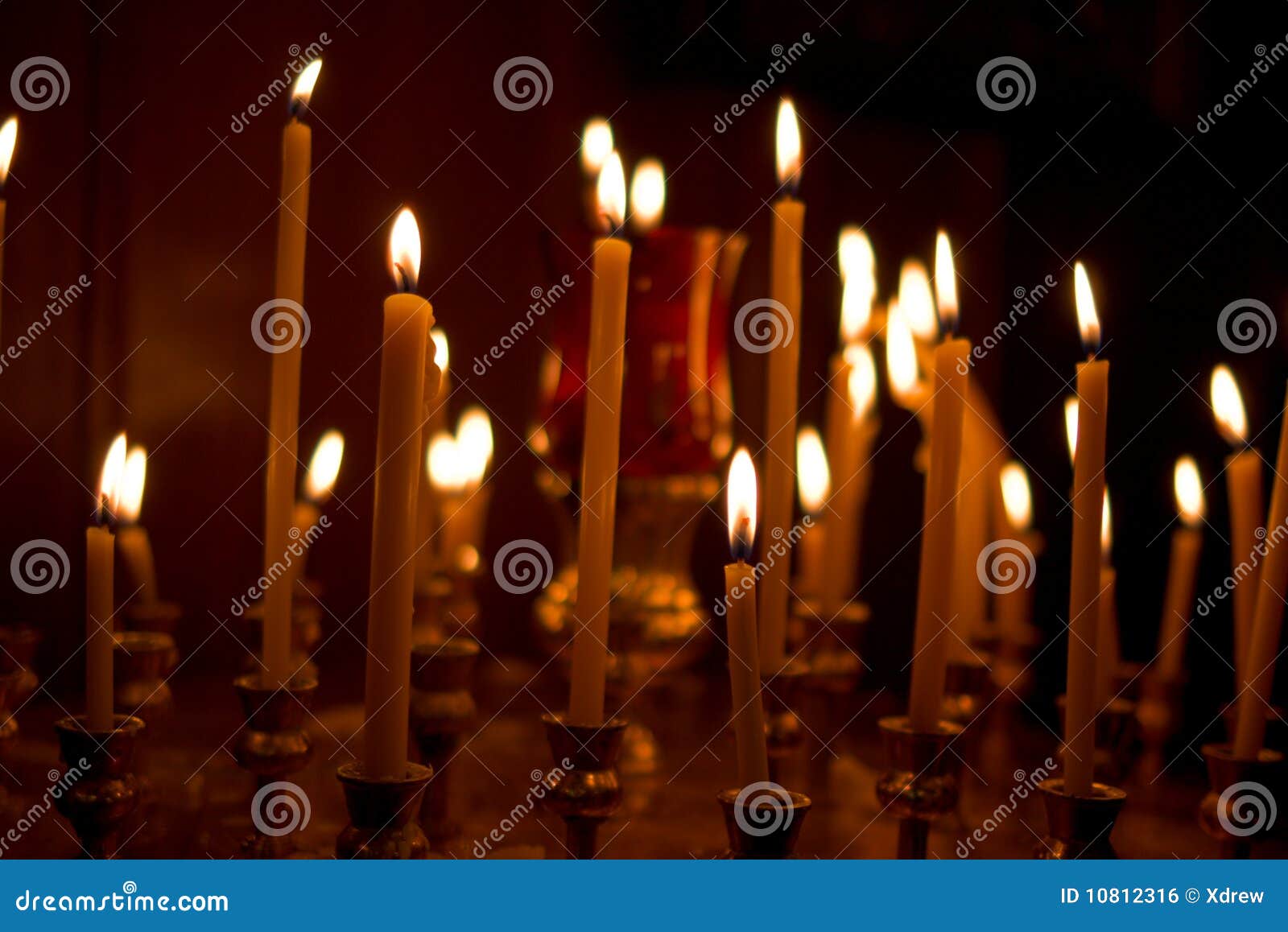 Many candles in a row stock photo. Image of composition - 10812316