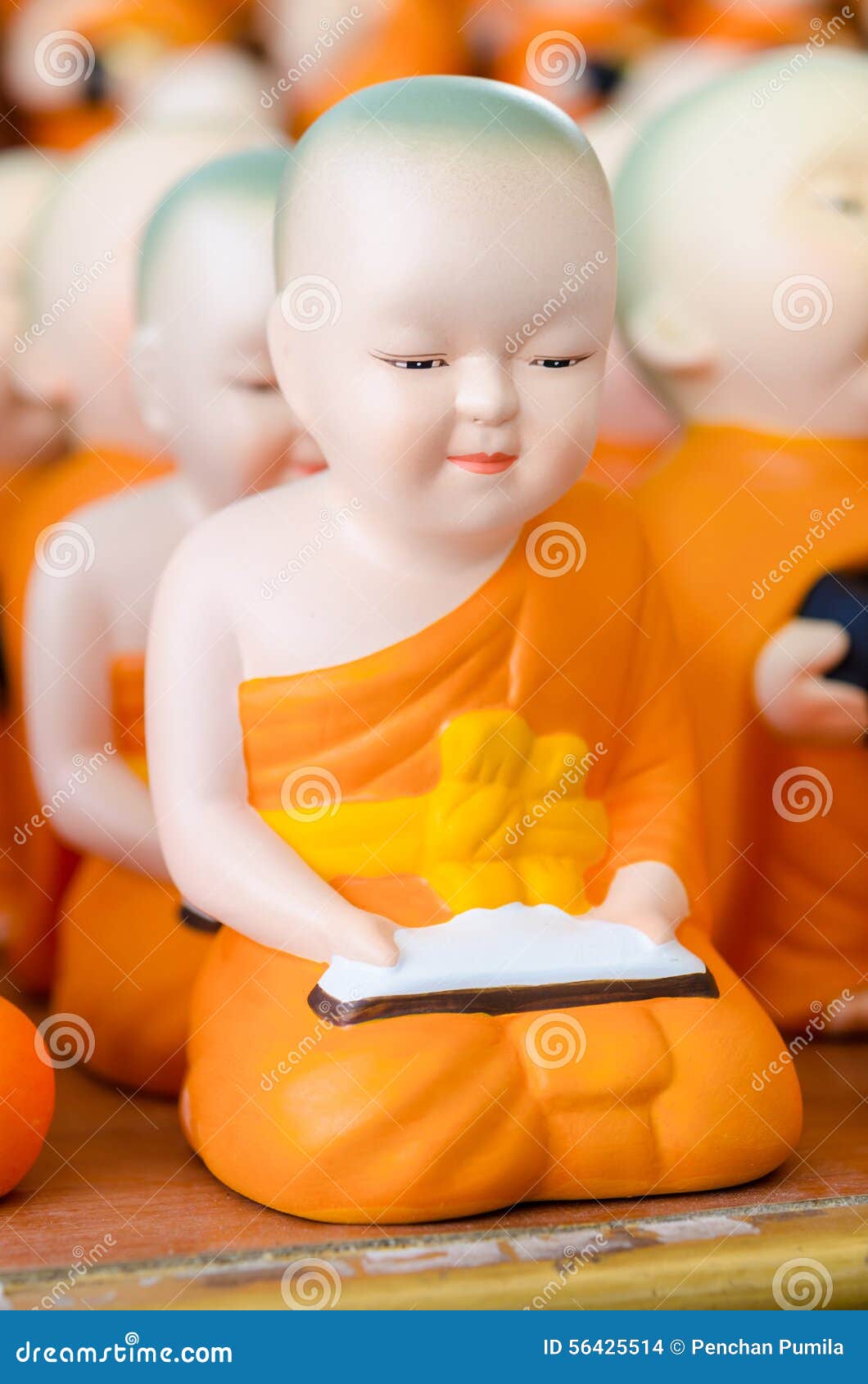 Many ceramic monk doll. stock photo. Image of expression - 56425514
