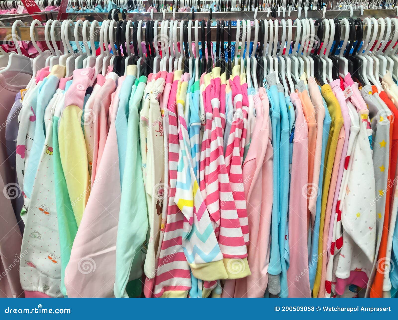 Many clothes hanging stock photo. Image of closet, green - 290503058