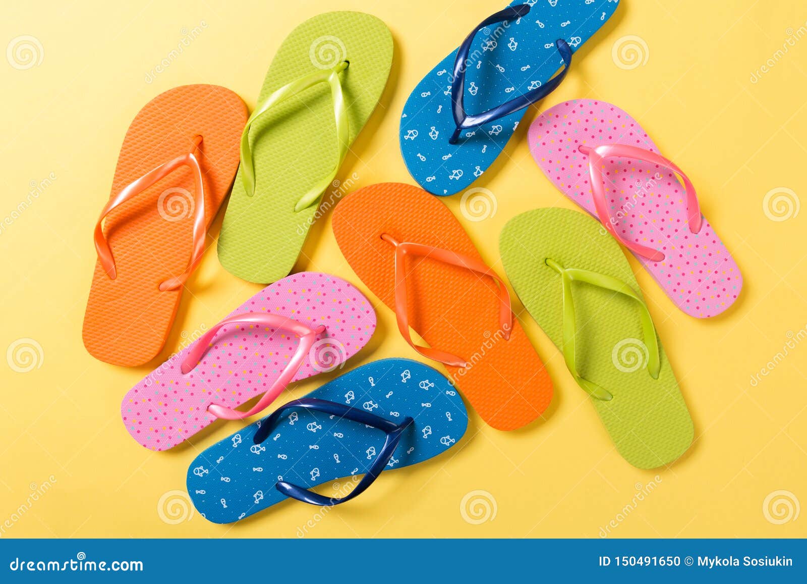 Many Colored Flip Flops on Yellow Background. Copy Space Top View Stock ...