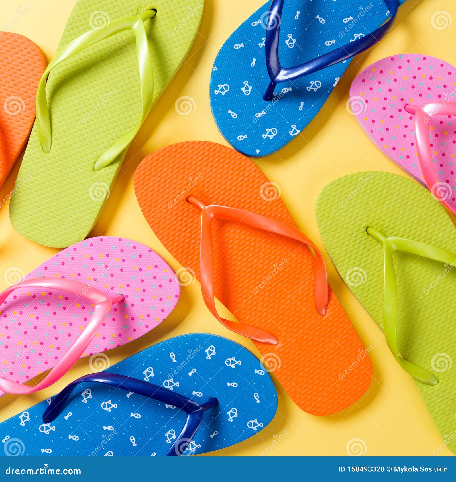 Many Colored Flip Flops on Yellow Background. Copy Space Top View Stock ...