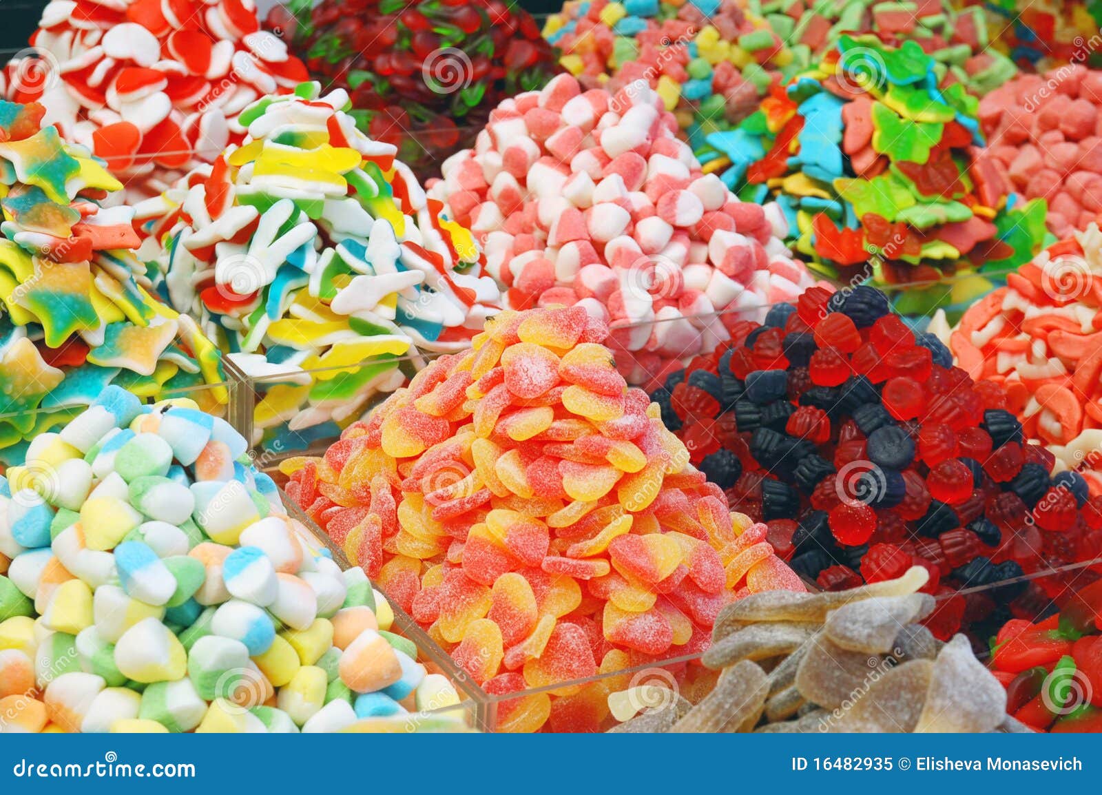 Many Colorful Sugary Cereal Grains On A Blue Background Stock ...