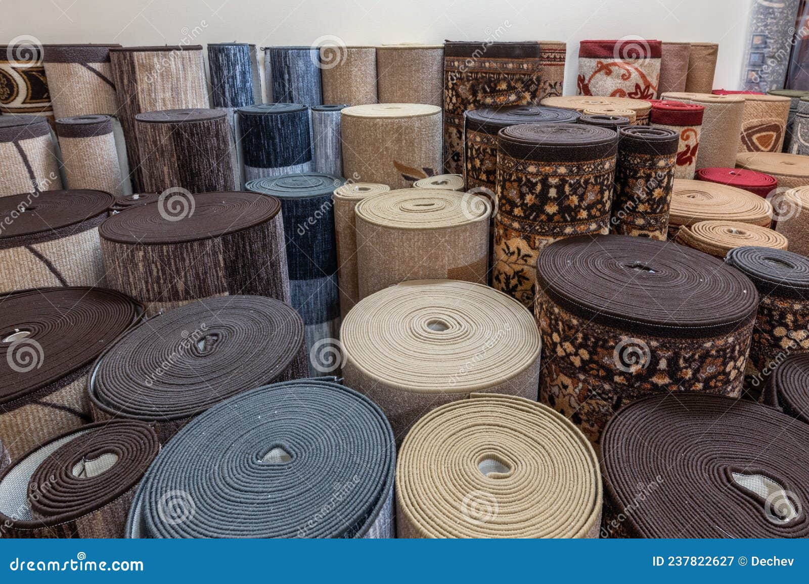 Many Colorful Carpets in the Store. Variety Selection Rolled Up Carpets ...