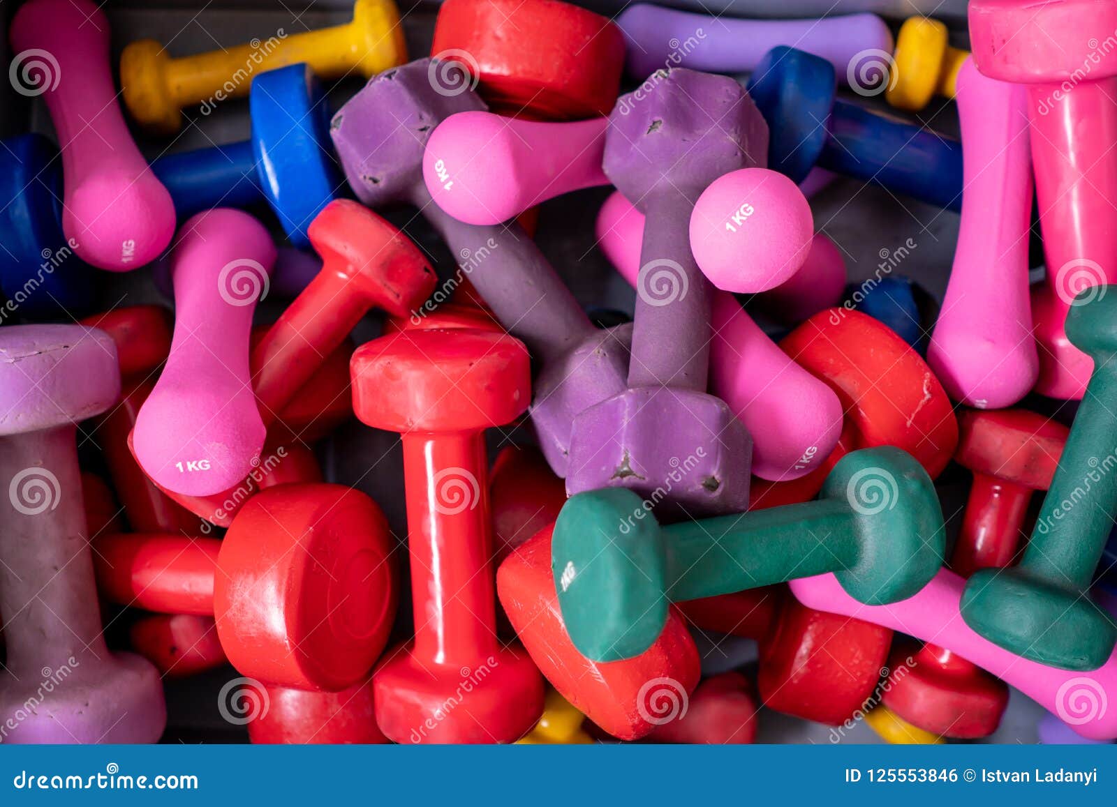 Many colorful dumbbells stock photo. Image of healthy - 125553846