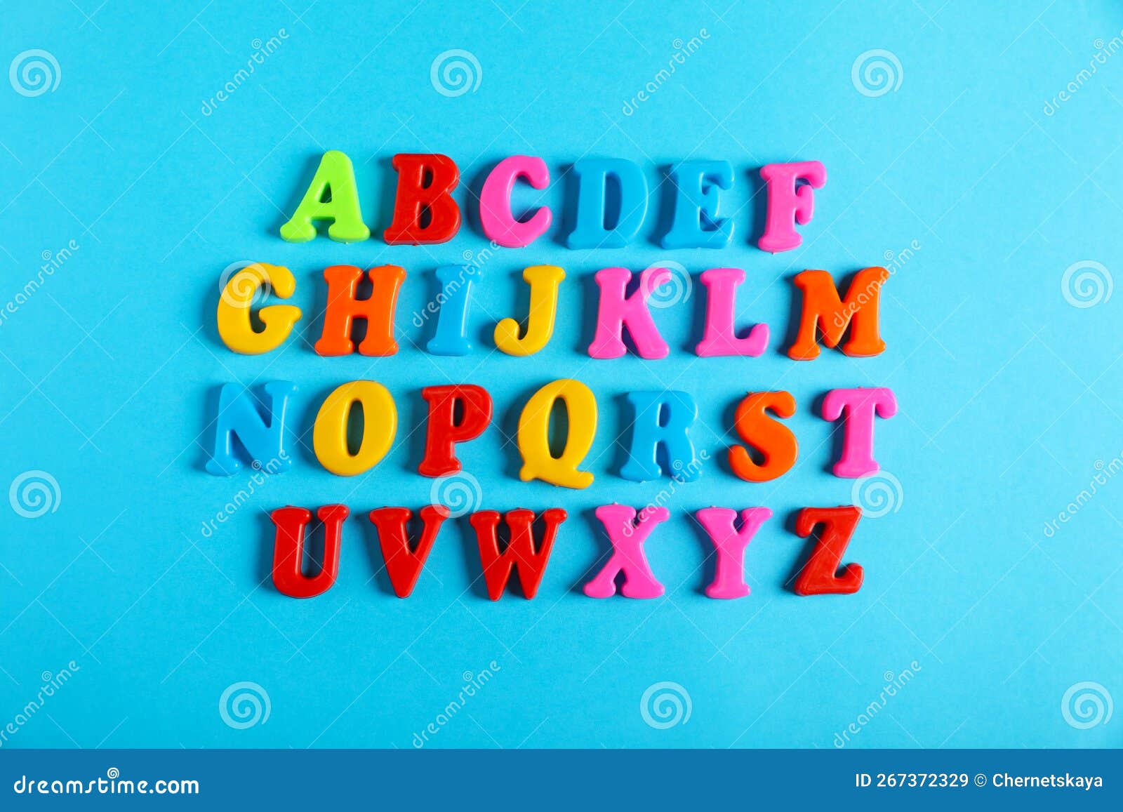 Many Colorful Magnetic Letters on Light Blue Background, Flat Lay ...