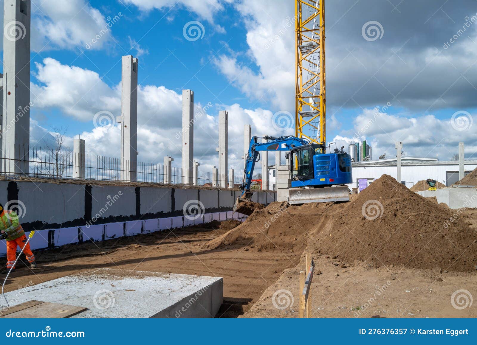 Concrete Pillars for a Factory Building are Erected on a Construction ...