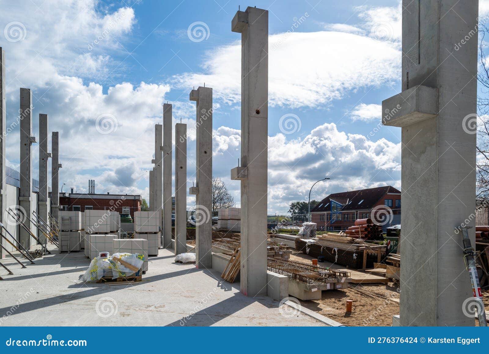 Concrete Pillars for a Factory Building are Erected on a Construction ...