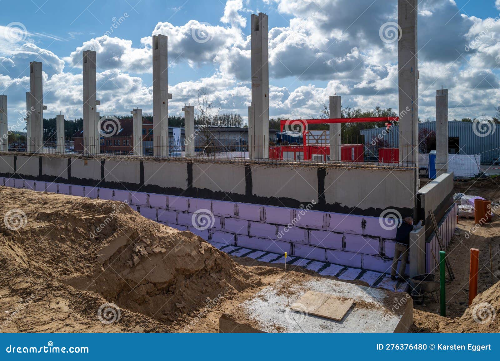 Concrete Pillars for a Factory Building are Erected on a Construction ...