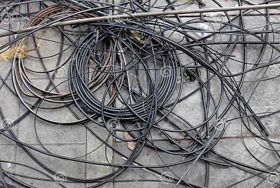 Many Confused Electrical Wires on Ground Stock Photo - Image of ...
