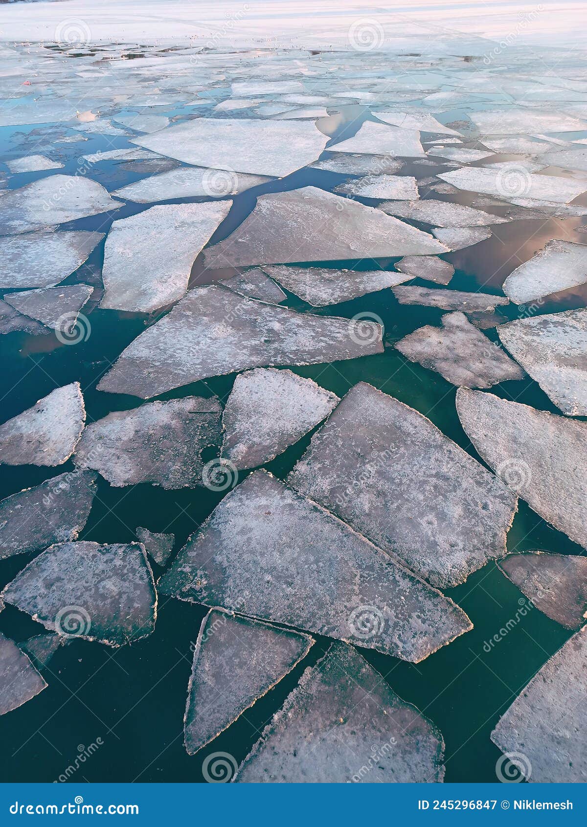 Many Debris of Ice Floes of Melted River Ice of Various Shapes Float on ...