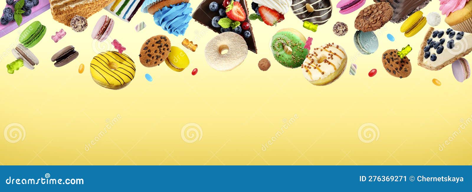 Many Delicious Sweets Falling on Yellow Gradient Background, Space for ...