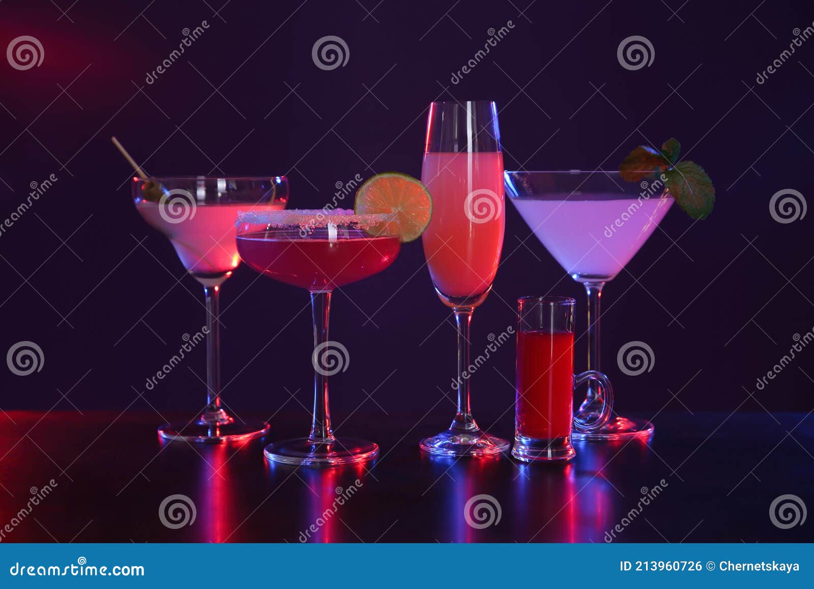 Many Different Alcoholic Drinks on Table Against Dark Background Stock ...