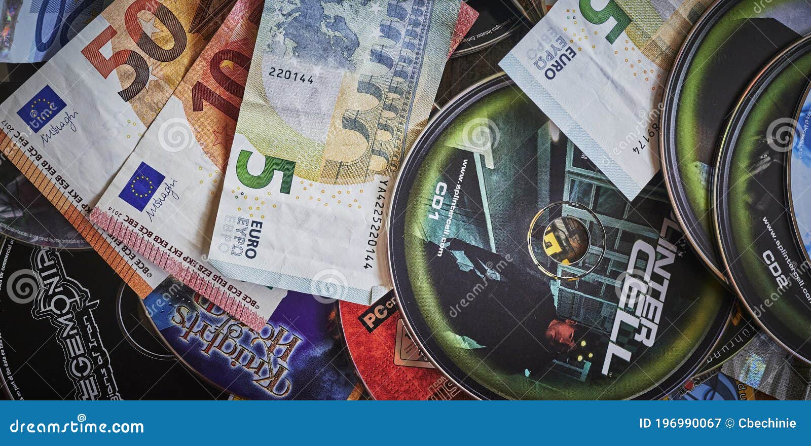 Many Different Discs of Computer Games Mixed with Euro Bank Notes ...