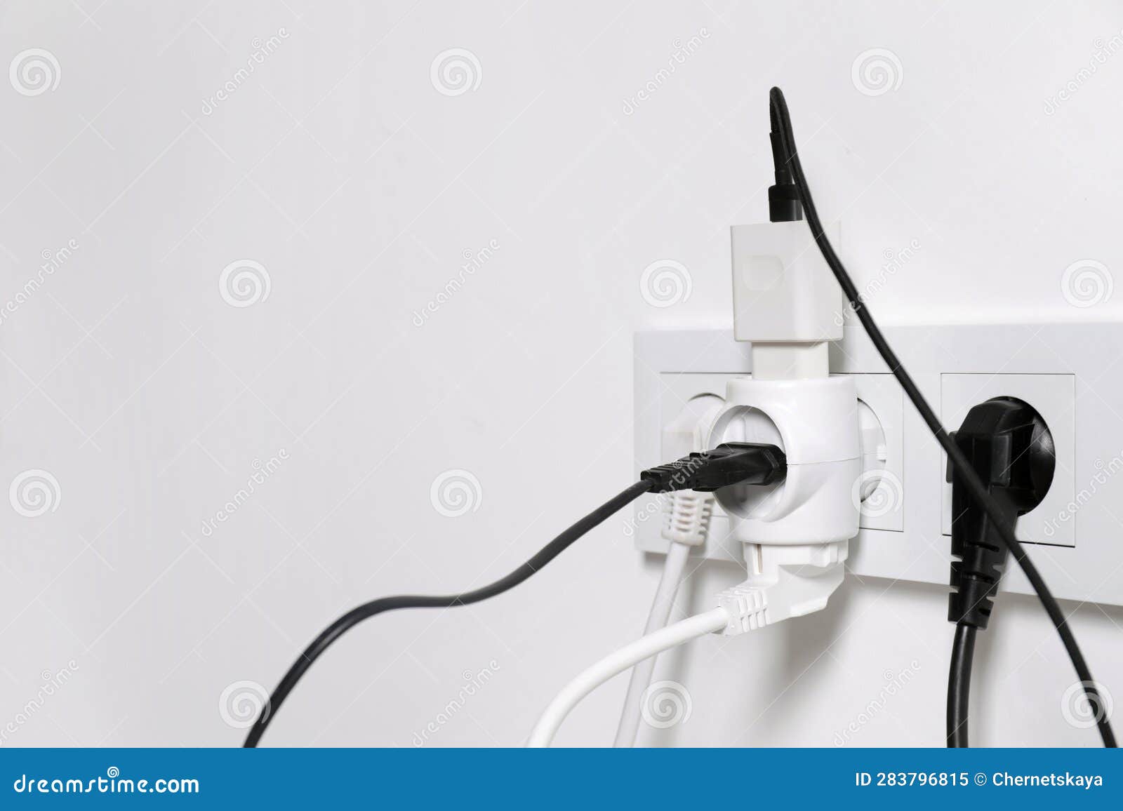 Many Different Electrical Power Plugs in Sockets on Light Wall, Space ...