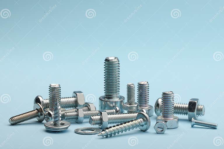 Many Different Fasteners on Light Blue Background, Closeup Stock Photo ...