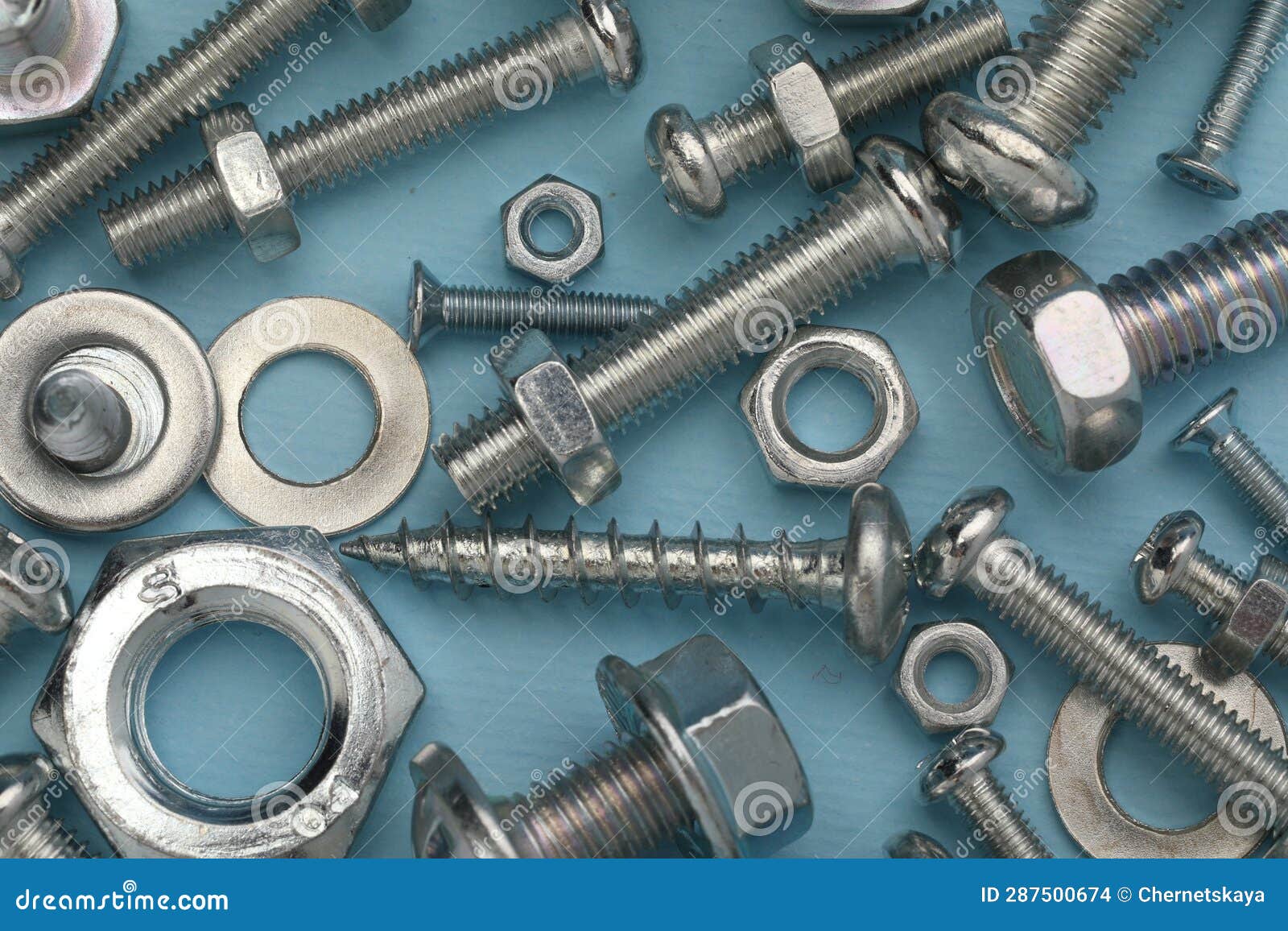 Many Different Fasteners on Light Blue Background, Flat Lay Stock Photo ...