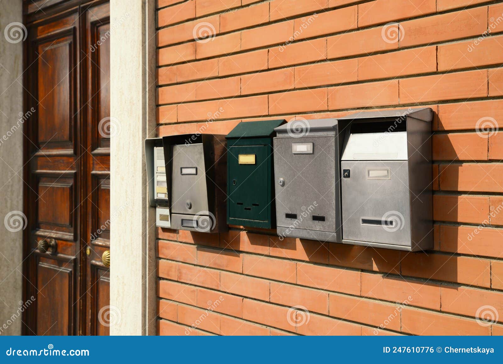 Many Different Mailboxes on Red Brick Wall of Building Stock Photo ...