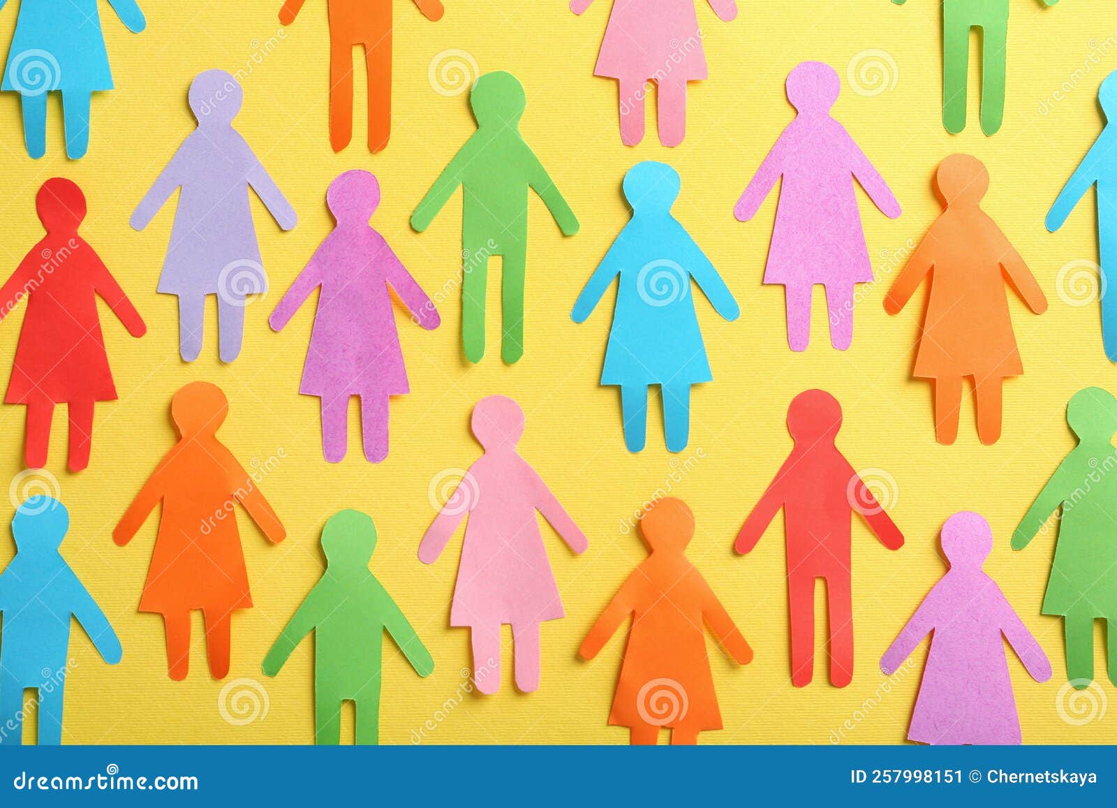 Many Different Paper Human Figures on Yellow Background, Flat Lay ...