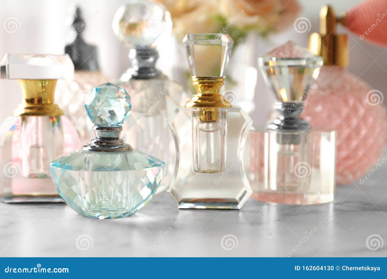 Many Different Perfume Bottles on Table Stock Photo - Image of feminine ...