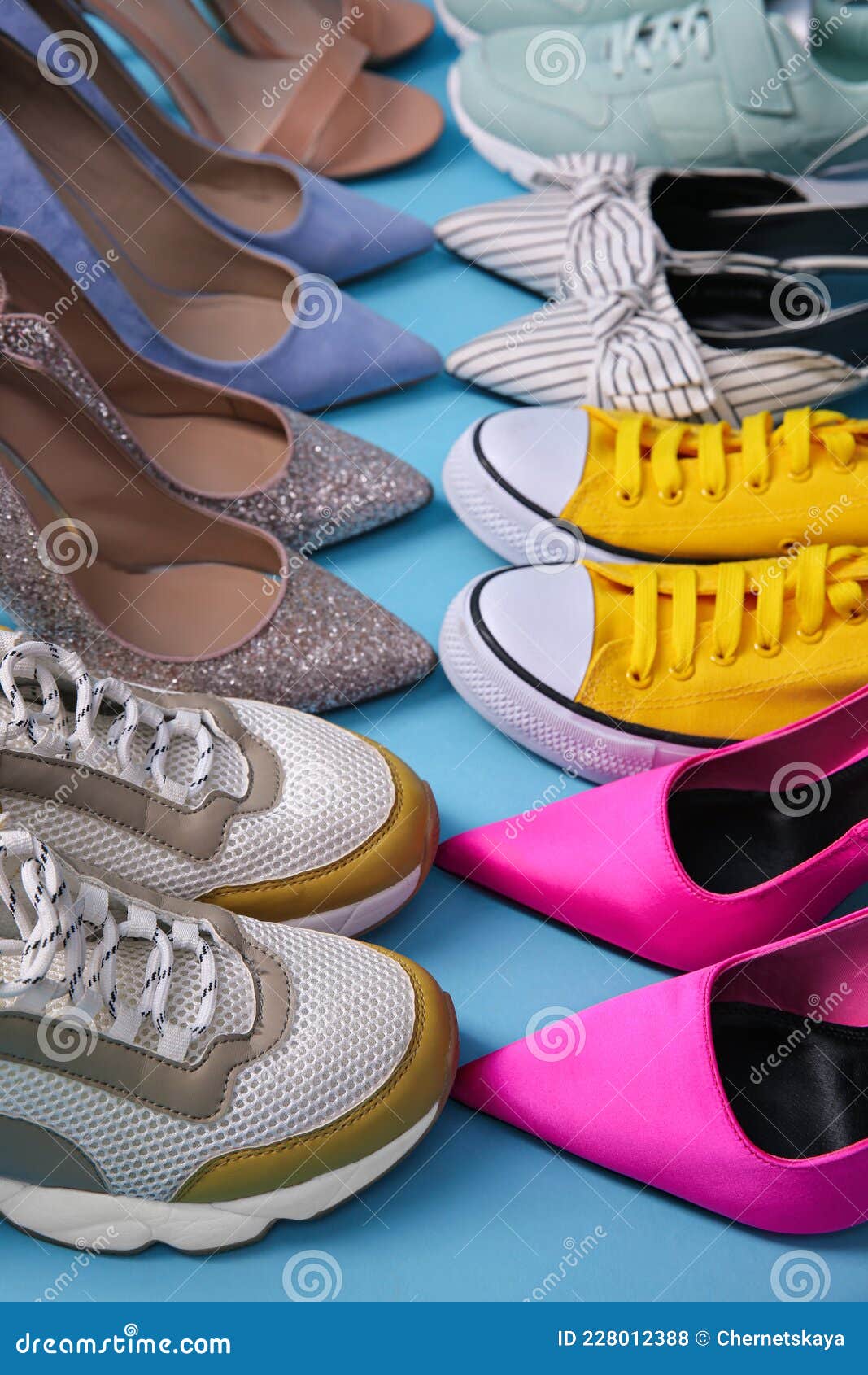Many Different Shoes on Turquoise Background, Closeup. Diversity ...