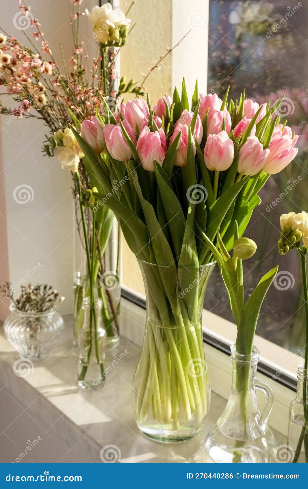 Many Different Spring Flowers and Branches with Leaves on Windowsill ...