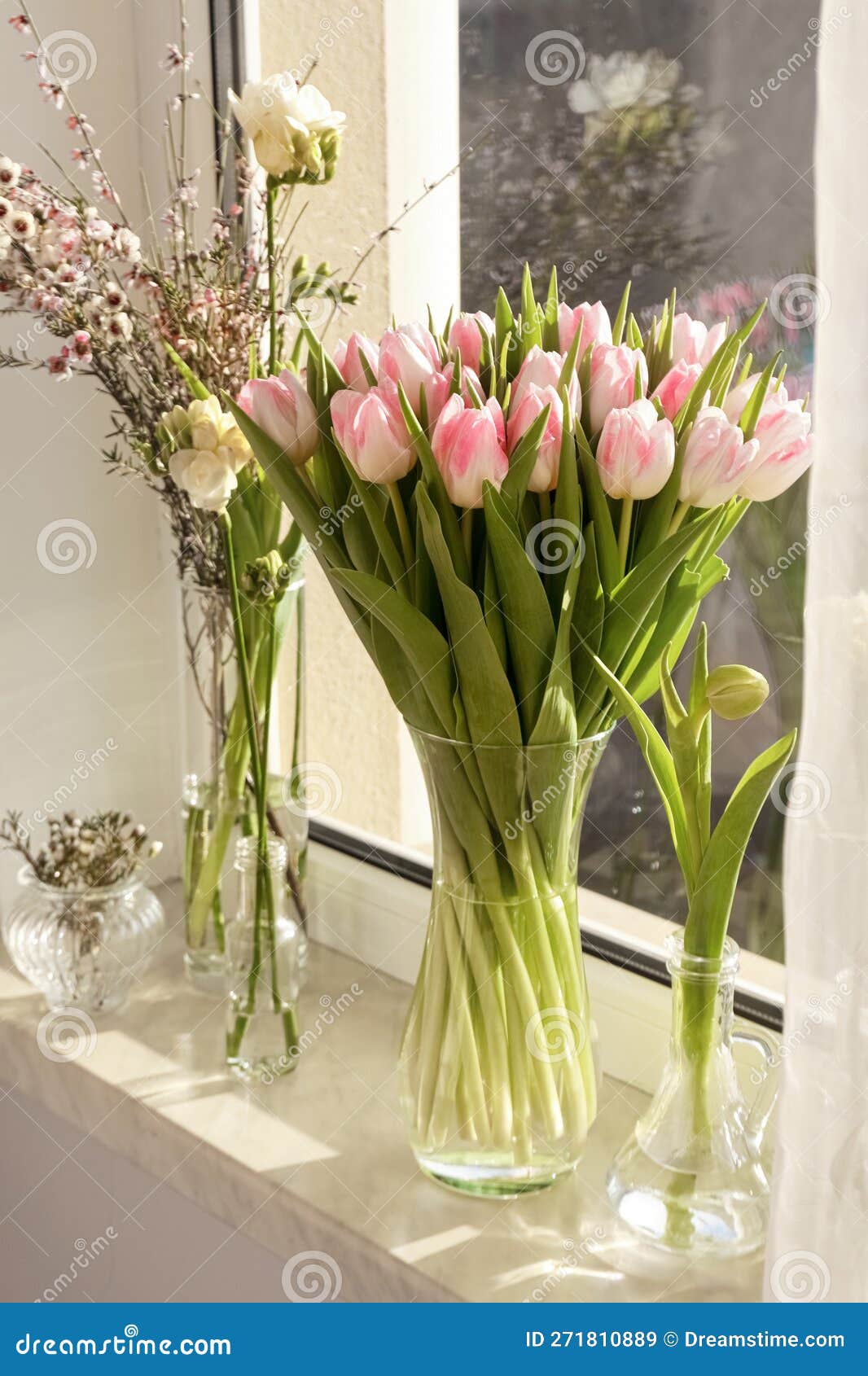 Many Different Spring Flowers and Branches with Leaves on Windowsill ...