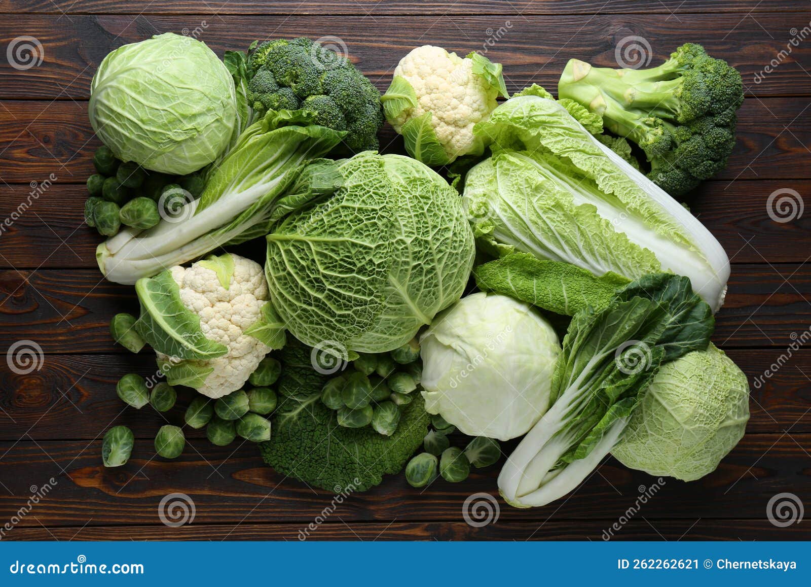 Many Different Types of Fresh Cabbage on Wooden Table, Flat Lay Stock ...
