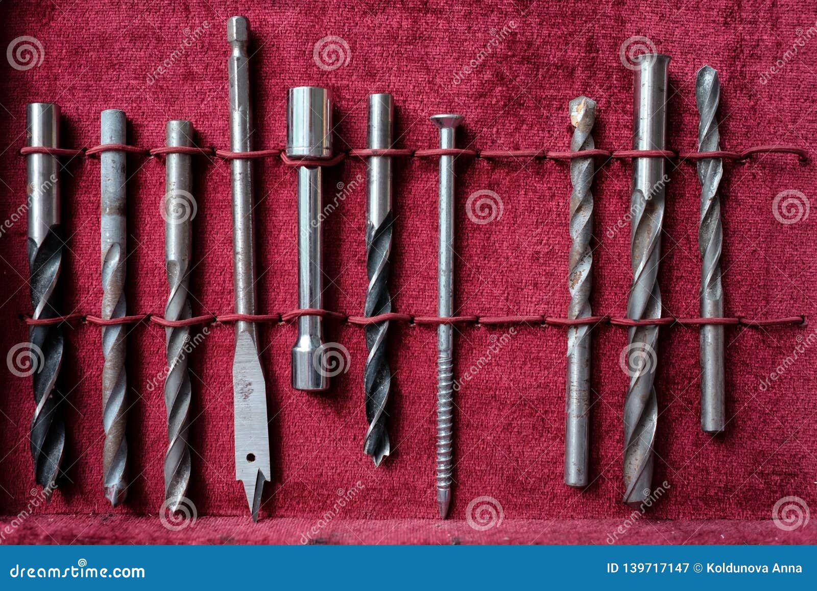 Many Drill Bits of Various Size on Red Background. Stock Image - Image ...