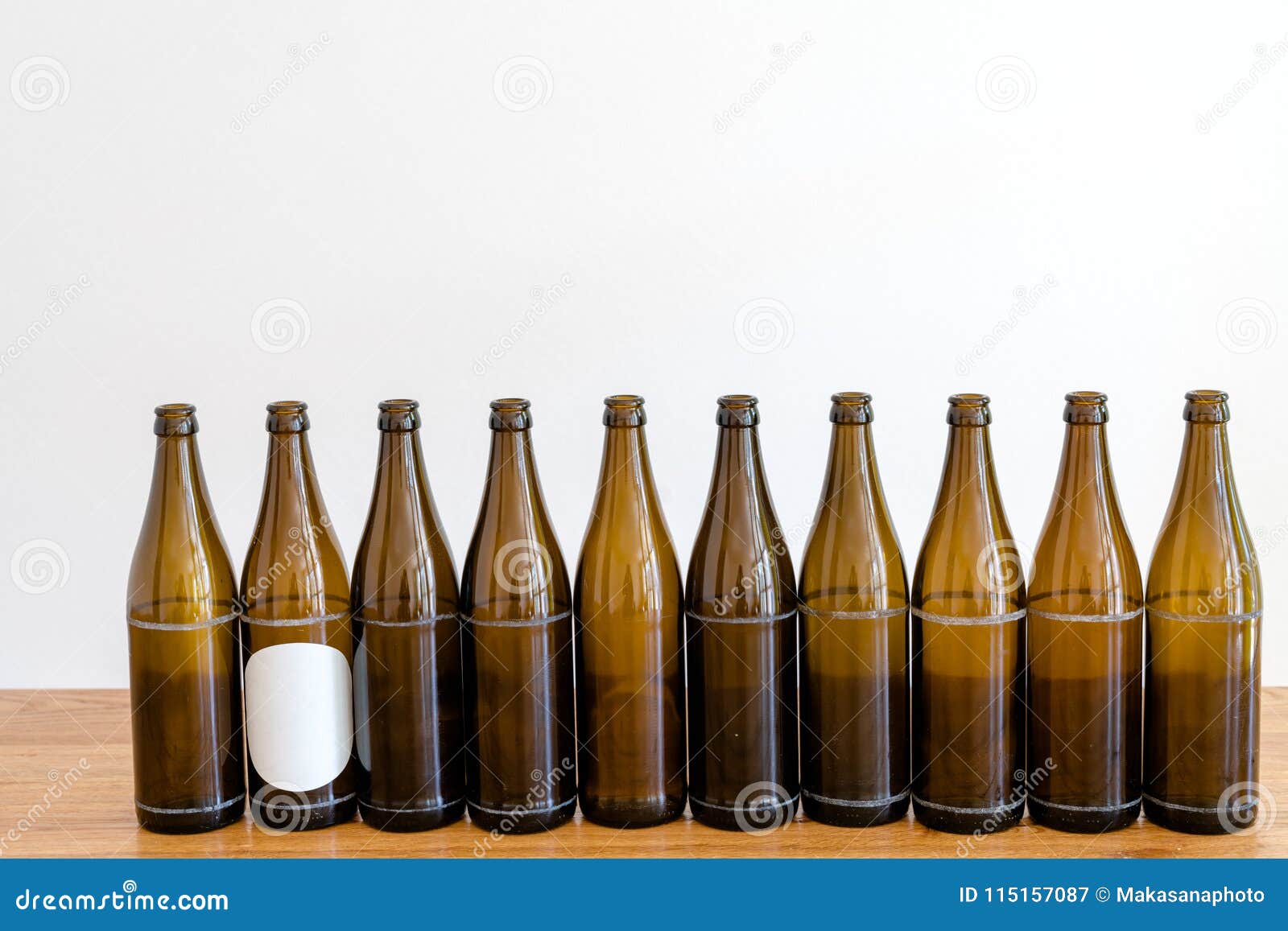 Many Empty Brown Beer Bottles on a Wooden Table Stock Image - Image of ...