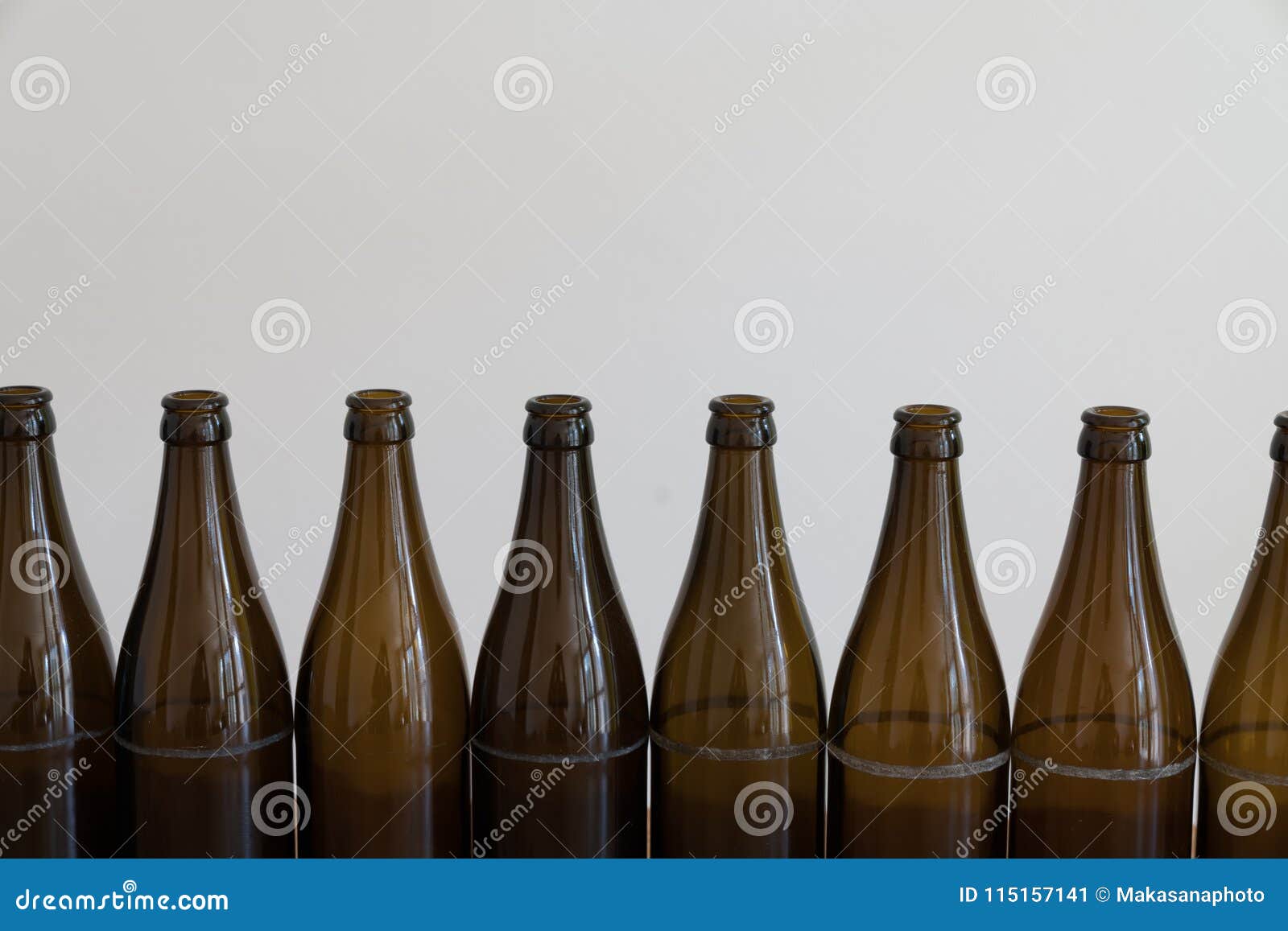 Many Empty Brown Beer Bottles on a Wooden Table Stock Image - Image of ...
