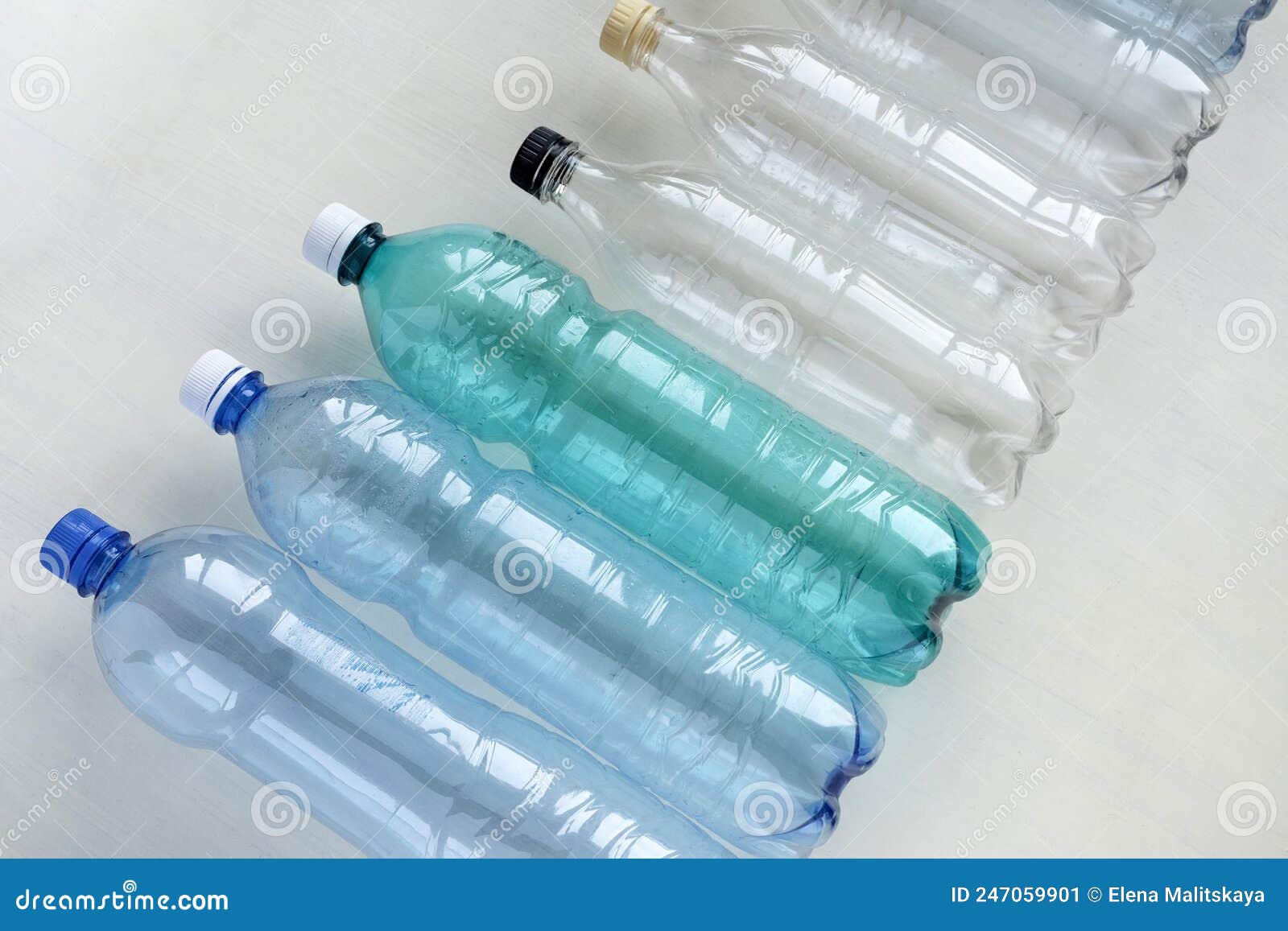 Many Empty Plastic Bottles Lie on a White Table Stock Image - Image of ...