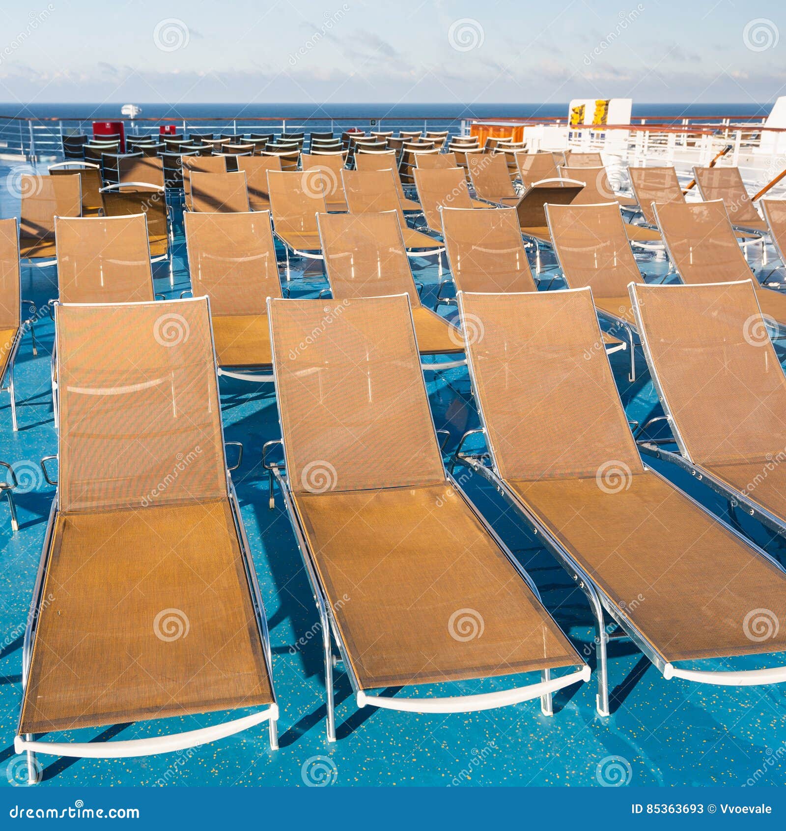 Many Empty Sunbathing Chairs on Upper Deck Stock Image - Image of blue ...