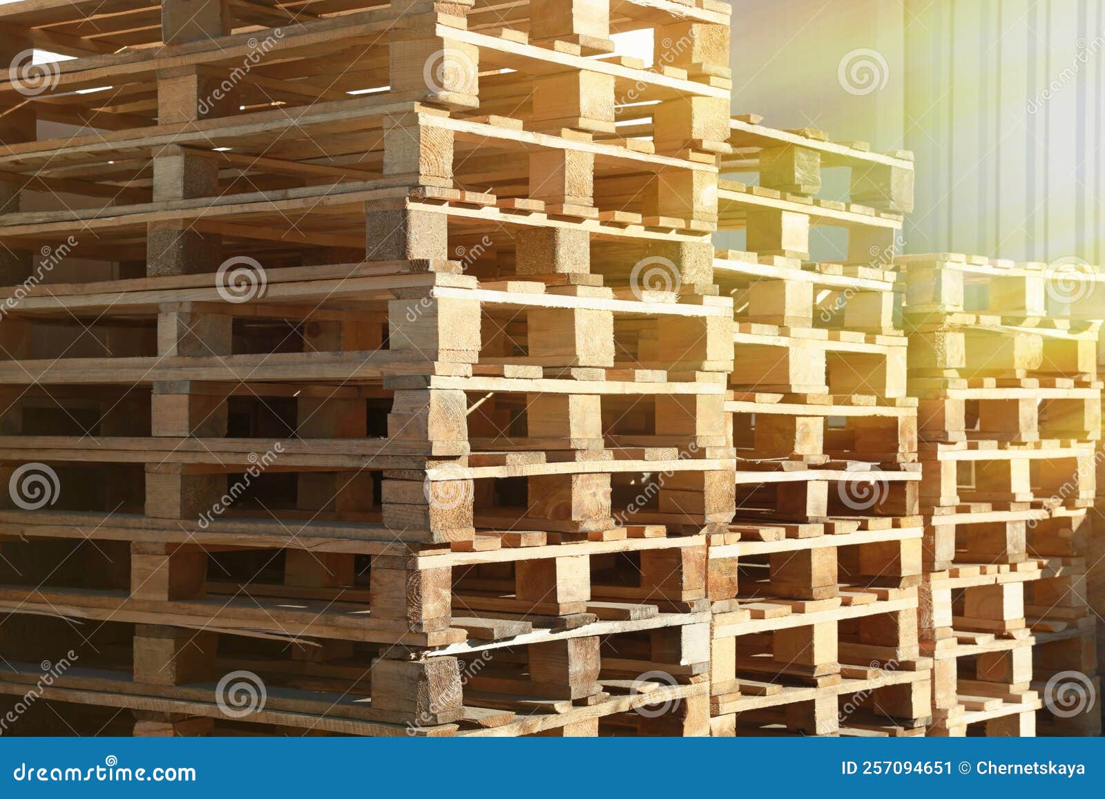 Many Empty Wooden Pallets Stacked in Warehouse Stock Image - Image of ...