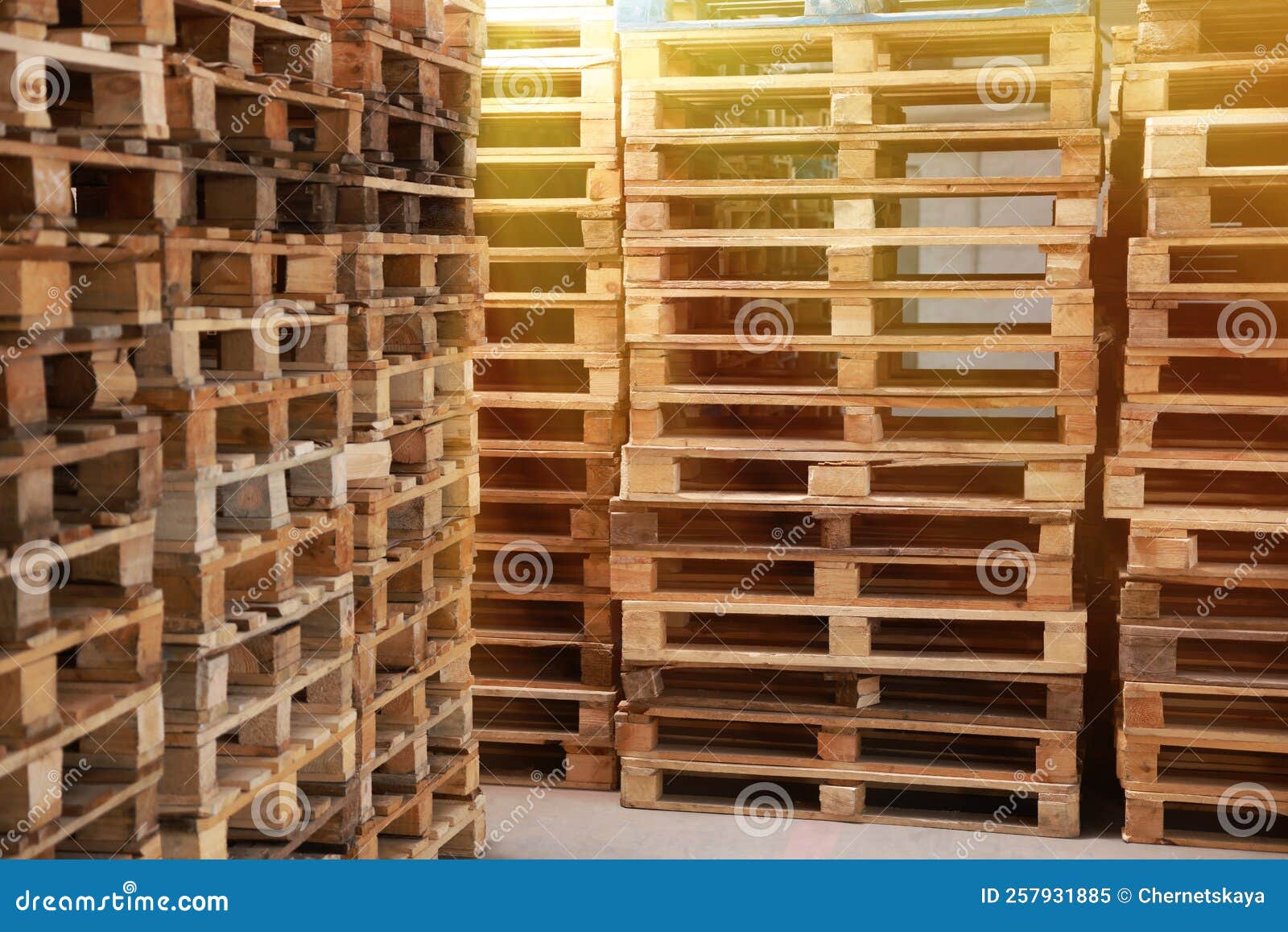 Many Empty Wooden Pallets Stacked in Warehouse Stock Image - Image of ...